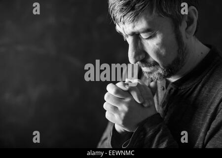 Pious man praying to his god, asking for forgiveness. Spiritual person ...