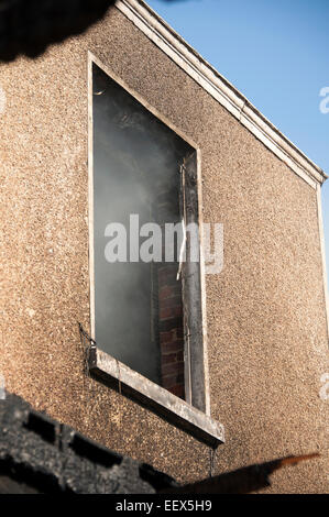 Smoke coming from bedroom window of house on fire Stock Photo - Alamy