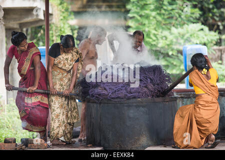 Production of coir or coconut fibres, worker in a factory in Sri Lanka ...