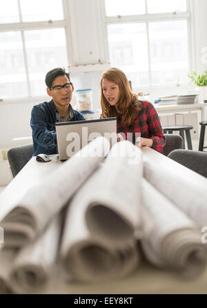 Young redhead woman working at office Stock Photo - Alamy