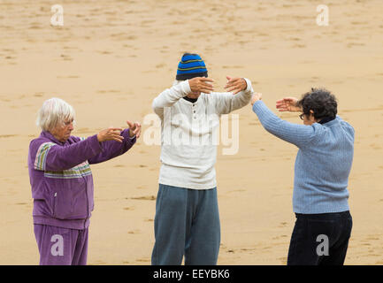 Three elderly people appear to be hugging Invisible trees as they ...