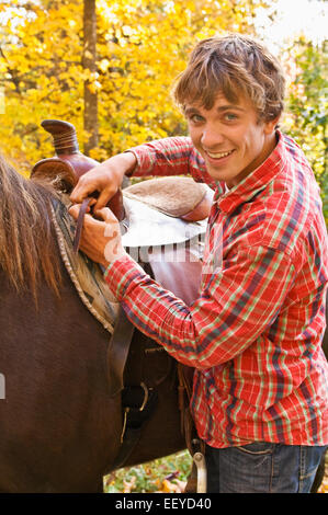 Young Man Rider With Her Horse Enjoying Good Mood in Evening Sunset ...
