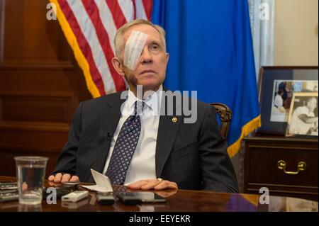 US Democratic Senate Leader Harry Reid with a patch over his injured ...