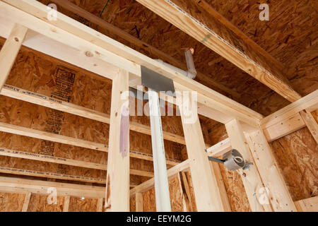 New home construction, plumbing through the framing Stock Photo - Alamy