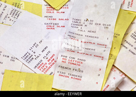 Greasy restaurant guest food order tickets in pile Stock Photo - Alamy