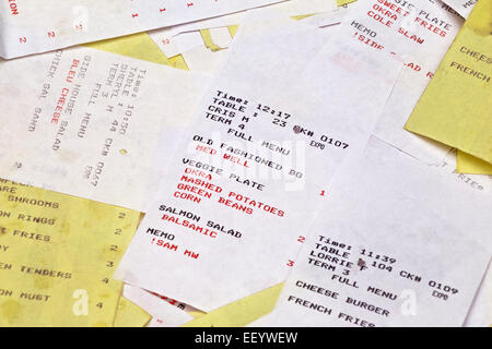 Greasy restaurant guest food order tickets in pile Stock Photo - Alamy