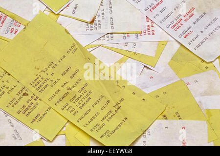 Greasy restaurant guest food order tickets in pile Stock Photo - Alamy