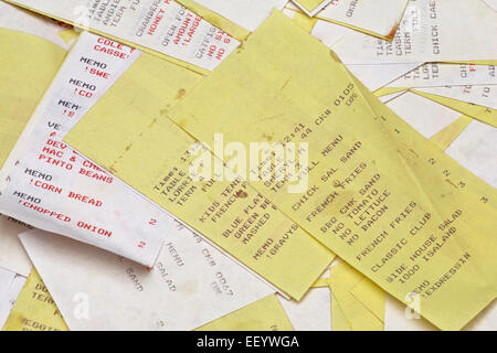 Greasy restaurant guest food order tickets in pile Stock Photo - Alamy