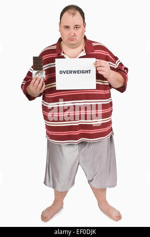 Unhappy man in striped t-shirt screaming and rubbing temples because of ...