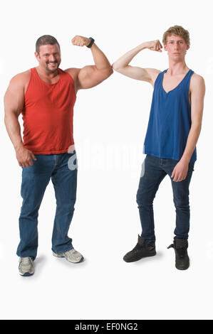 Muscular man and skinny man flexing their biceps Stock Photo - Alamy