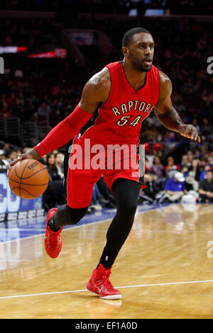 Toronto Raptors forward Patrick Patterson, left, battles for the ball ...