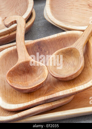 traditional rustic carved wooden spoons on cutting board Stock Photo ...