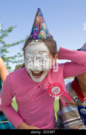 Child's face covered in icing Stock Photo - Alamy