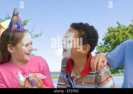 Children with icing on their faces Stock Photo - Alamy