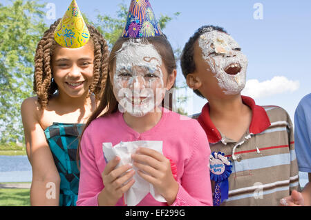 Children with icing on their faces Stock Photo - Alamy