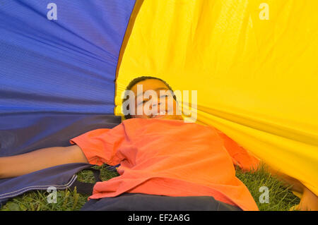 Boy under a parachute Stock Photo - Alamy