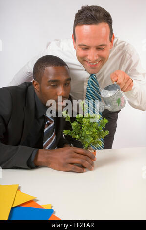 Business people, fun and potted plants concept - young funny ...