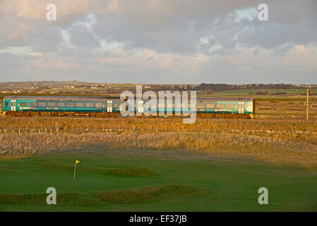 Arriva train passing through Rhosneigr Anglesey North Wales Uk Stock ...