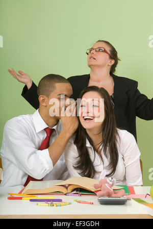 Teacher and multi race classroom having fun during a lesson Stock Photo ...