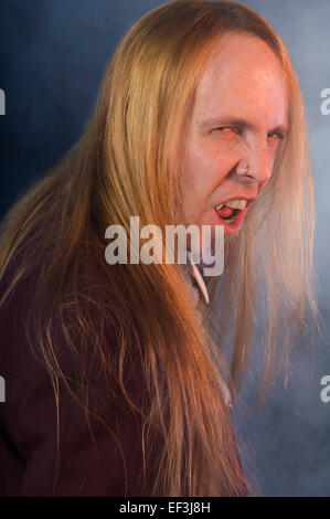 Man with long hair and a purple goatee Stock Photo - Alamy