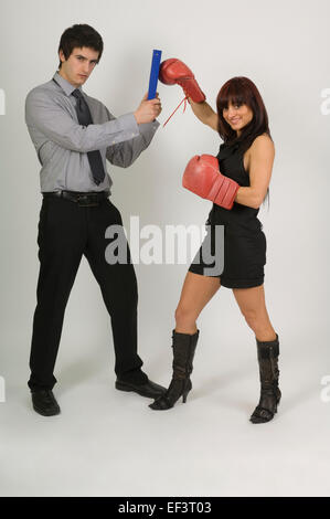 Young businessman employee wearing boxing gloves at workplace Stock ...