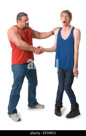 Muscular man shaking hands with a frightened skinny man Stock Photo - Alamy
