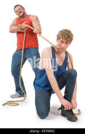 Two men having a tug of war Stock Photo - Alamy