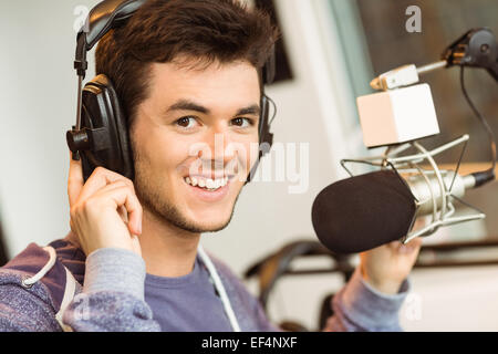 Portrait of an university student recording audio Stock Photo - Alamy