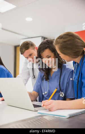 Medical students sitting and talking Stock Photo - Alamy