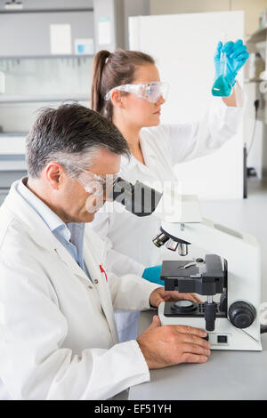Team of scientists at work Stock Photo - Alamy