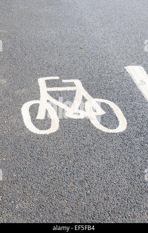 Painted cycle lane close up showing road and grass verge Stock Photo ...
