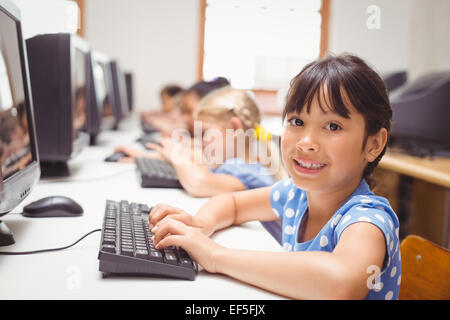 Cute pupils in computer class Stock Photo - Alamy