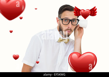 Composite image of geeky businessman eavesdropping with cup Stock Photo ...