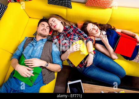 Tired, sleeping and group of students on desk in classroom at school ...