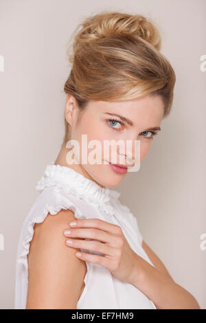 Attractive young woman model posing in field of sunflowers Stock Photo ...