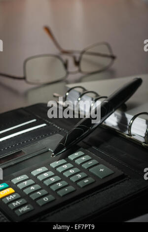 Empty notepad with pen eyeglasses and calculator Stock Photo - Alamy