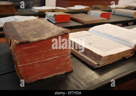 Thick old textbooks on the tables in the classroom Stock Photo - Alamy