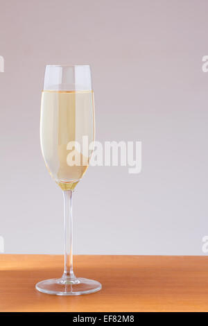 White wine on table on wooden background Stock Photo - Alamy