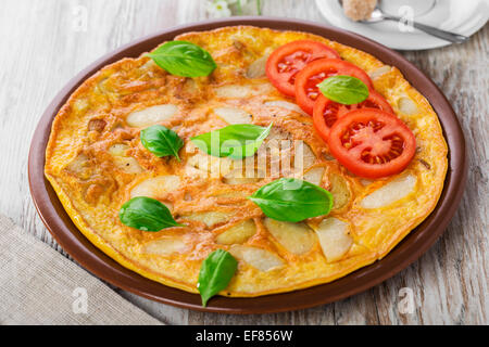 Potato omelette on a plate Stock Photo - Alamy