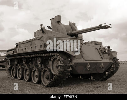 World War II era tank with blue sky and clouds - horizontal format ...