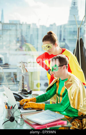 Superhero businessman working in the office Stock Photo - Alamy