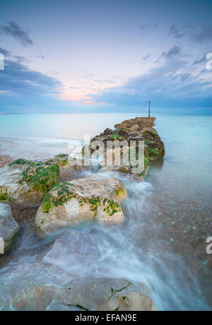 Aldwick Bay pebble beach and blue sea seen on an early morning in ...