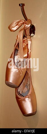 Hanging ballet shoes on grey wall Stock Photo - Alamy