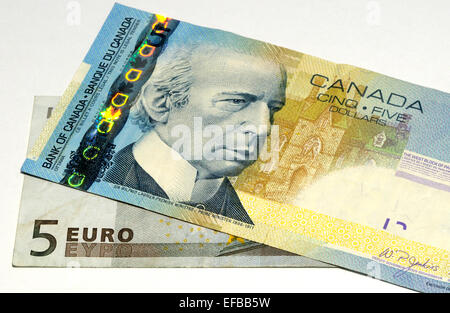 Canadian Dollar notes and European Euro notes photographed together ...