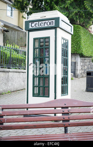 Old style Irish telephone box, bus shelter in small village in rural ...