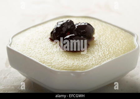 Semolina pudding with jam. Traditional dessert. Food UK Stock Photo - Alamy
