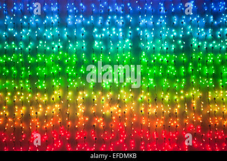 Magical Christmas tree with a rainbow glow Stock Photo - Alamy