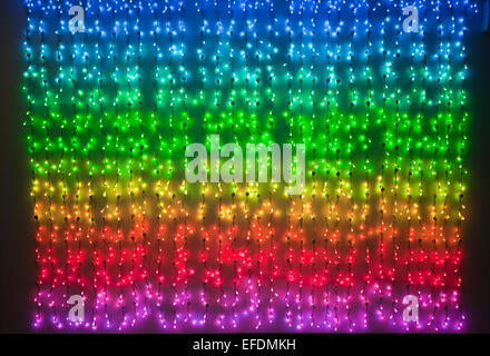 Magical Christmas tree with a rainbow glow Stock Photo - Alamy