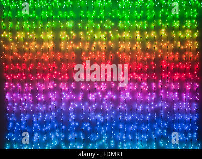 Magical Christmas tree with a rainbow glow Stock Photo - Alamy