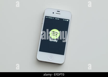 A view of the logo and homescreen of the Spotify app on an Apple iPhone ...